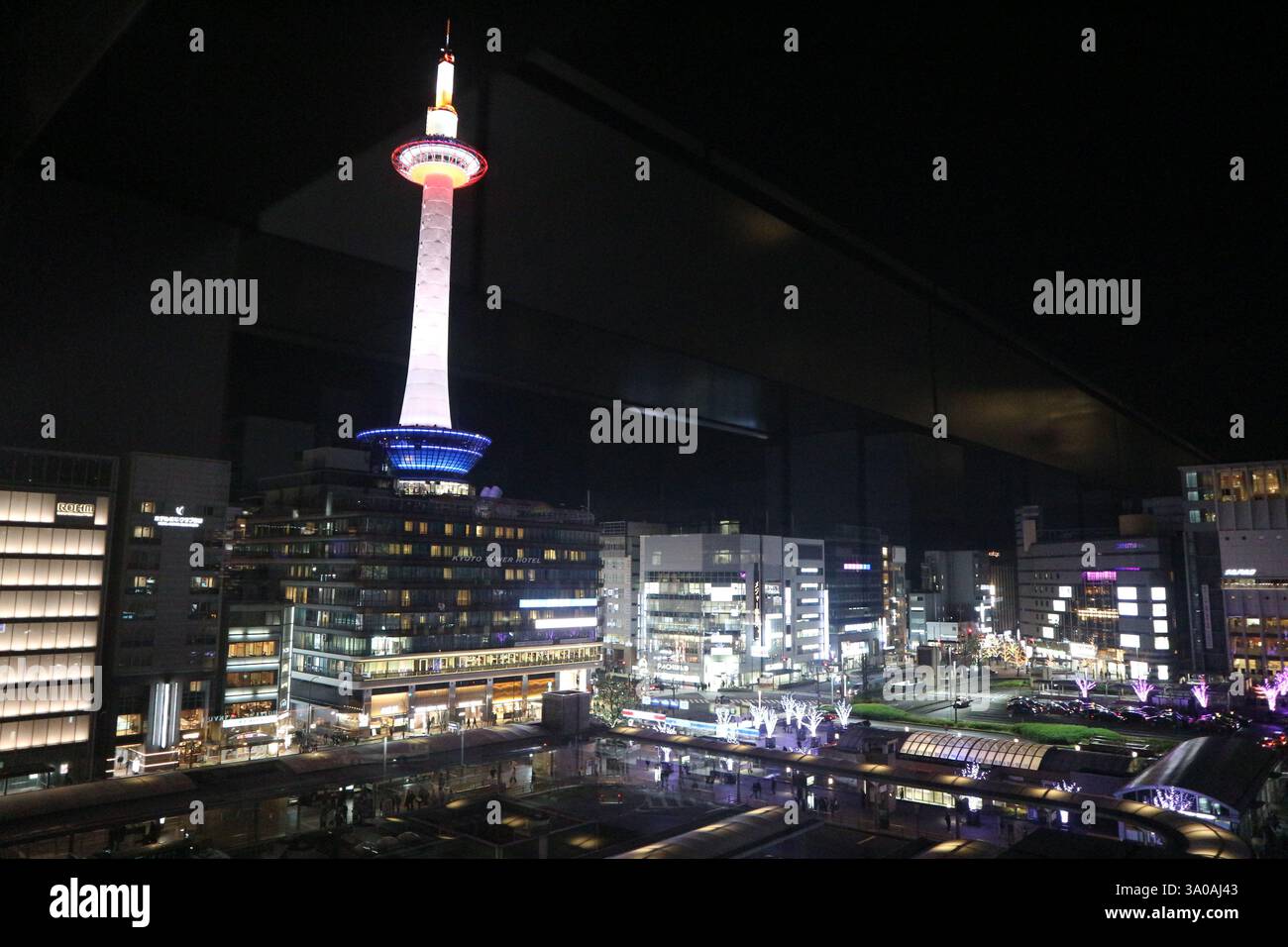 A breathtaking nighttime view of Kyoto Tower, Japan, standing tall ...