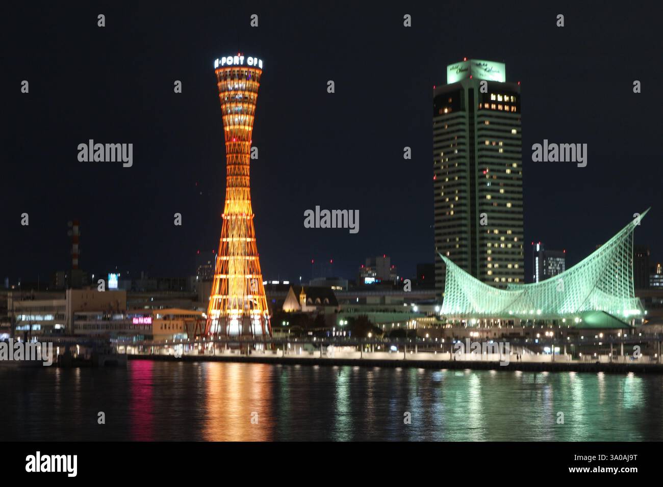Night view of Kobe Port Tower and Kobe Maritime Museum reflecting on ...