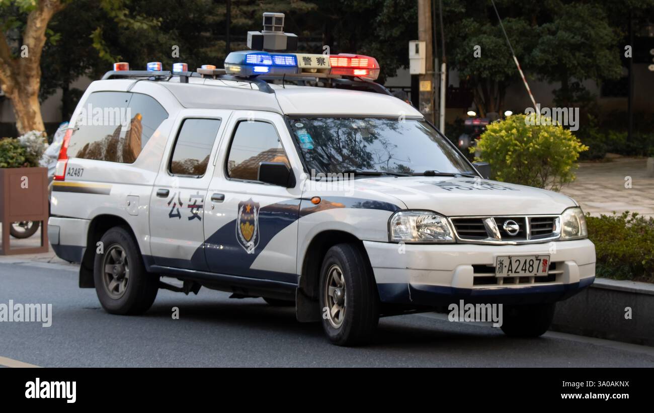 A Nissan NP300 Police patrol vehicle with lights on/China police/China ...