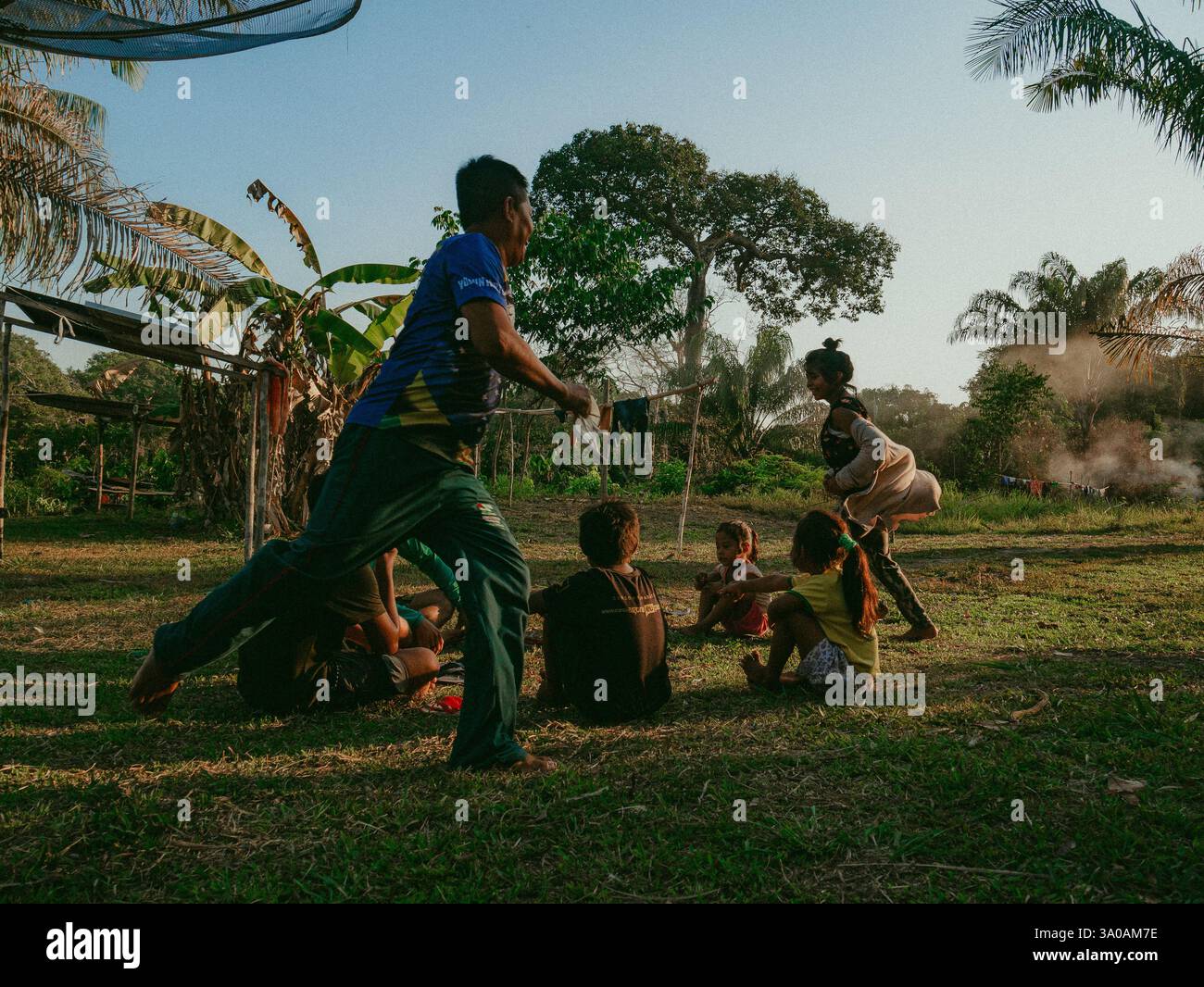 Indigenous people playing in a community in the Amazon Stock Photo - Alamy