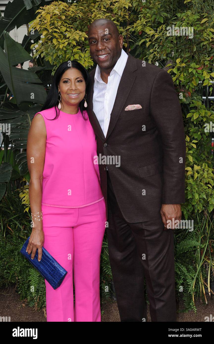 Cookie Johnson and Magic Johnson arriving at the premiere of Warner ...
