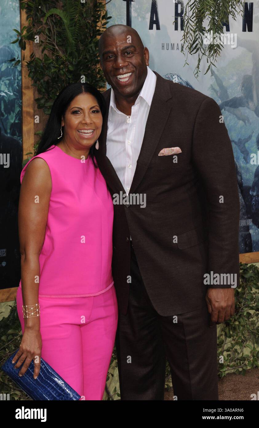 Cookie Johnson and Magic Johnson arriving at the premiere of Warner ...