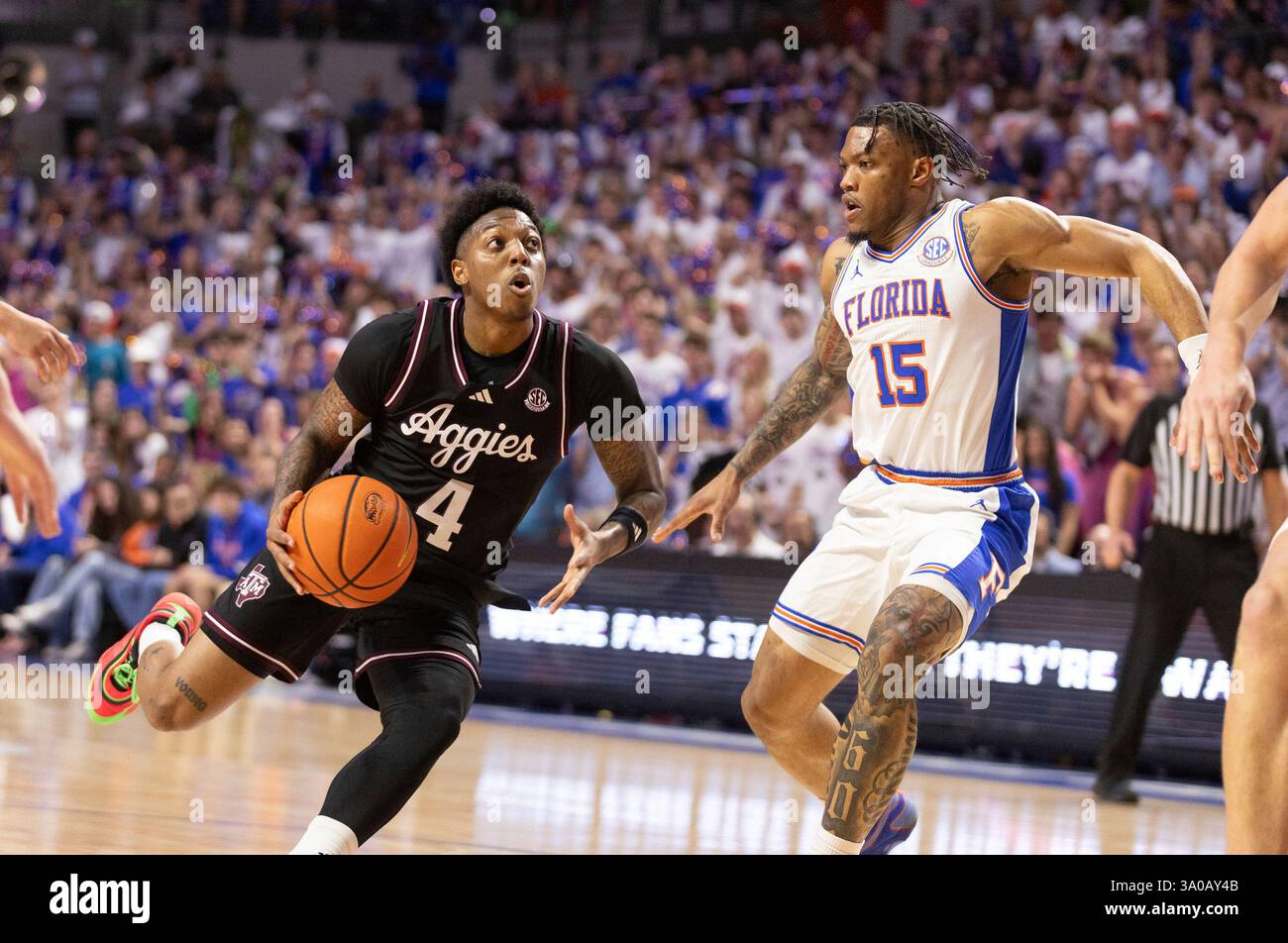 Texas A&M guard Wade Taylor IV (4) drives on Florida guard Alijah ...