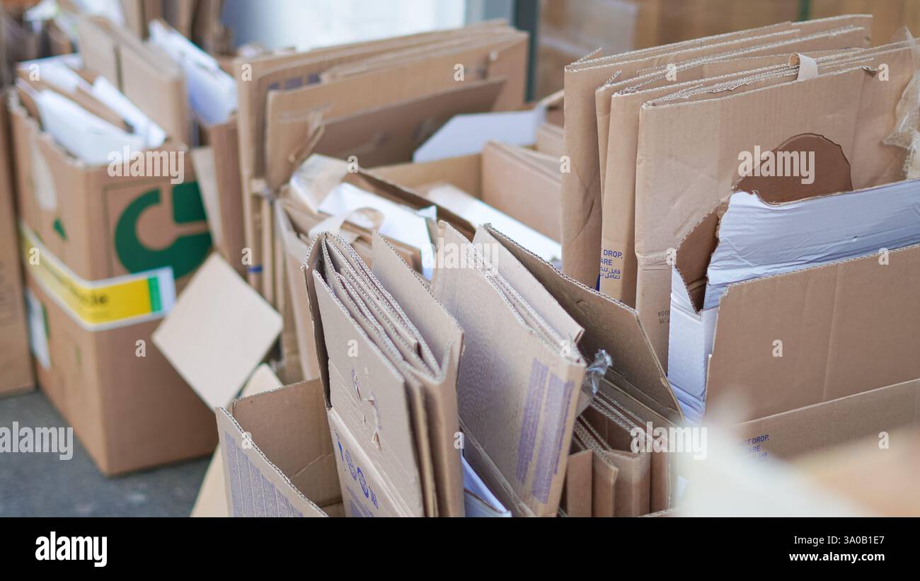 Compressed cardboard bundles outside, sorted and ready for waste ...
