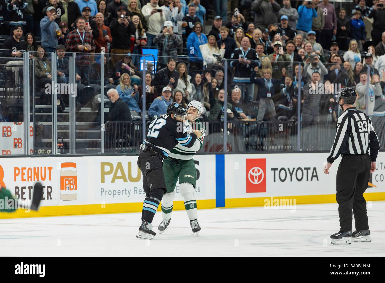 Minnesota Wild defenseman Jake Middleton (5) fights Utah Hockey Club ...