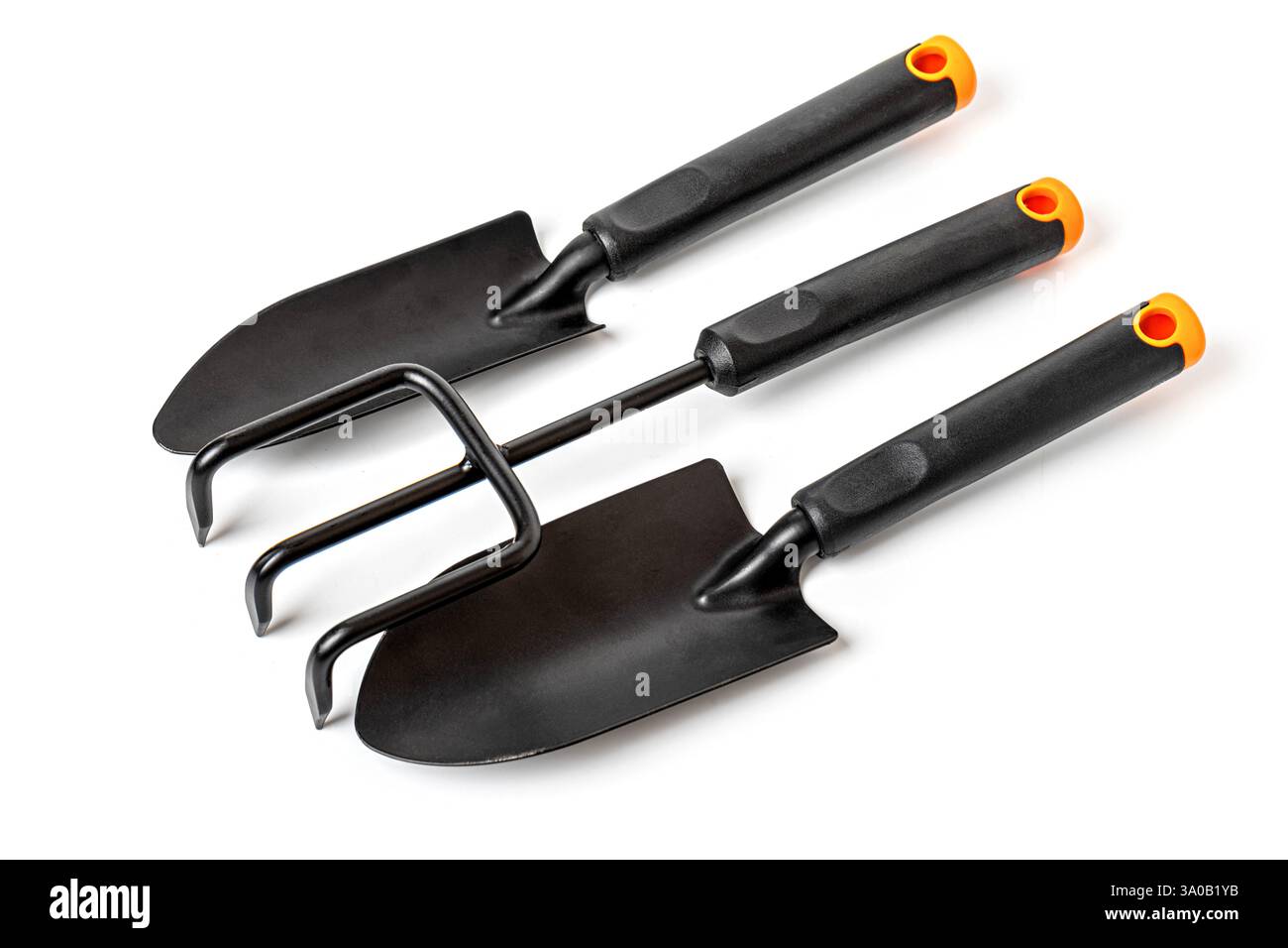 Small gardening tools set with trowel, hand rake and cultivator lying ...