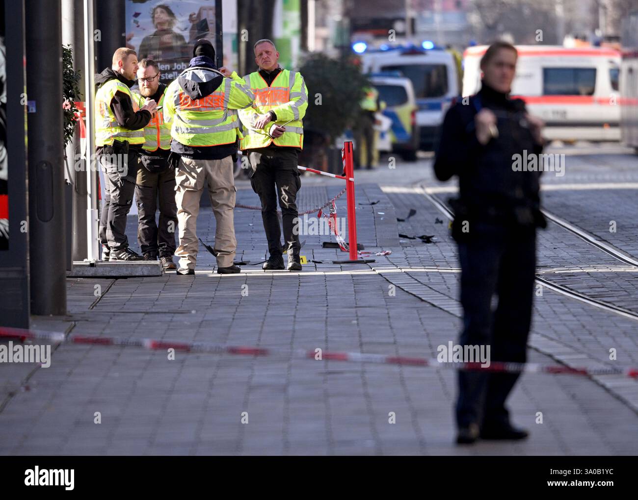 Police officers stand by during a major operation in the city center of ...