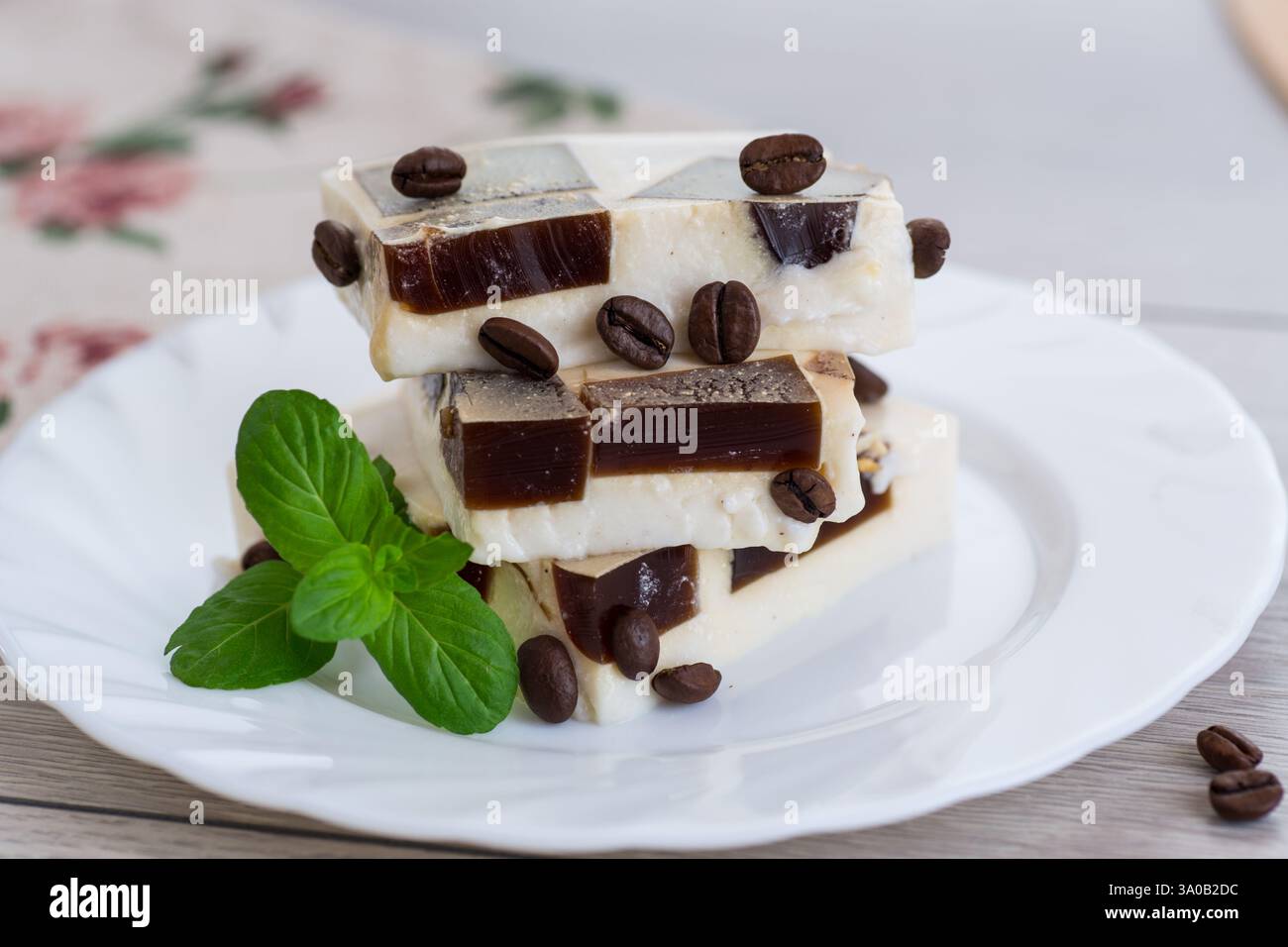 coffee jelly pieces inside white milk jelly Stock Photo - Alamy
