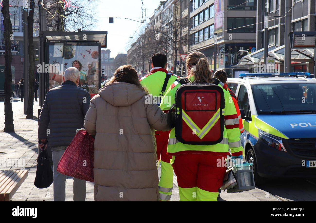 Rescue workers accompany people during a major police operation in the ...