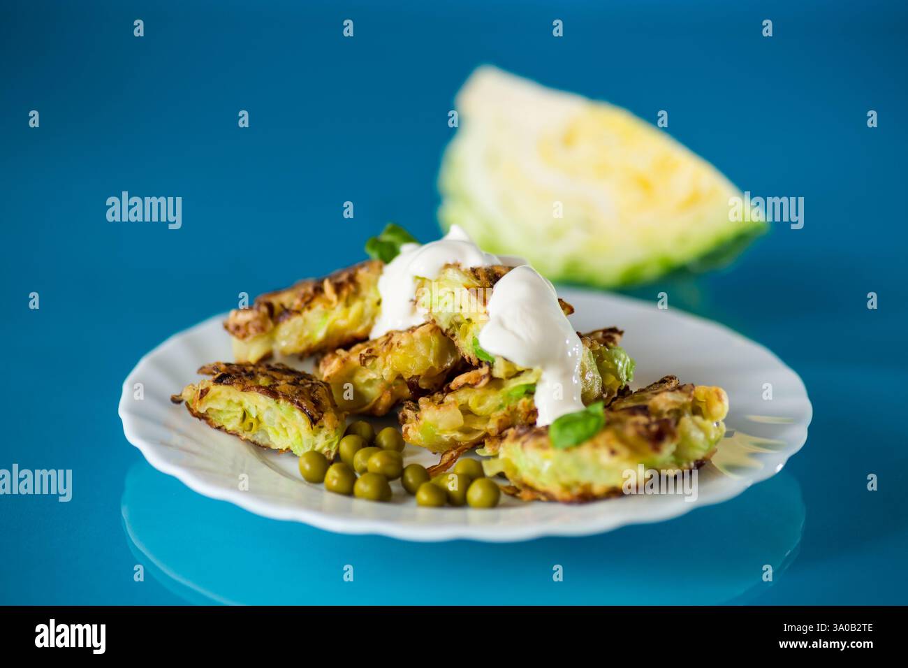 vegetable cabbage cutlets on a blue background Stock Photo - Alamy