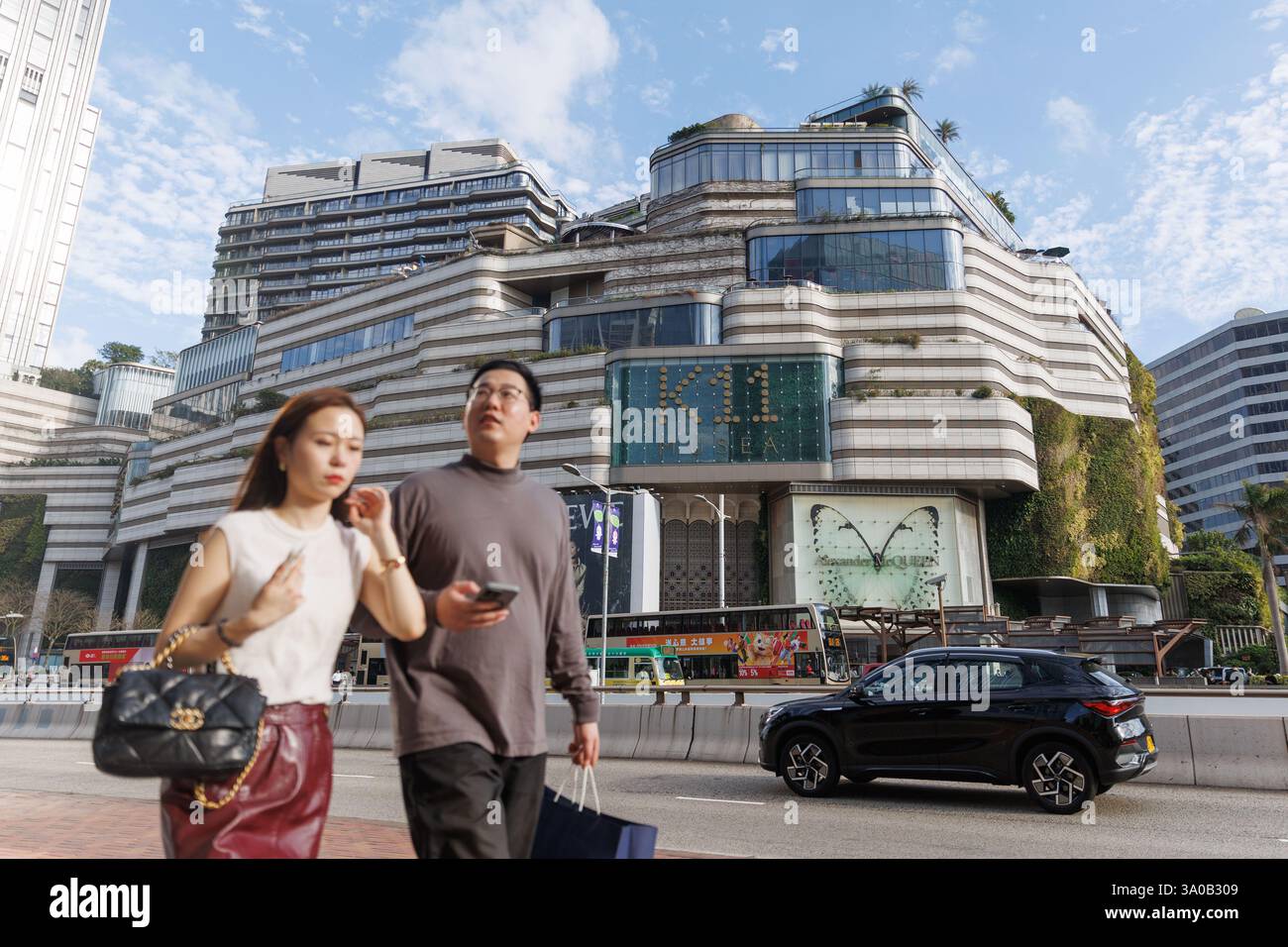 People walk past K11 Musea, a shopping mall combine with retail, art, culture and entertainment ...