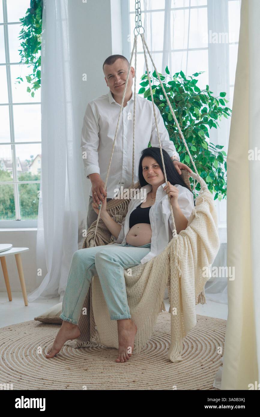 Family pregnancy photoshoot with father, pregnant mother, and son Stock ...