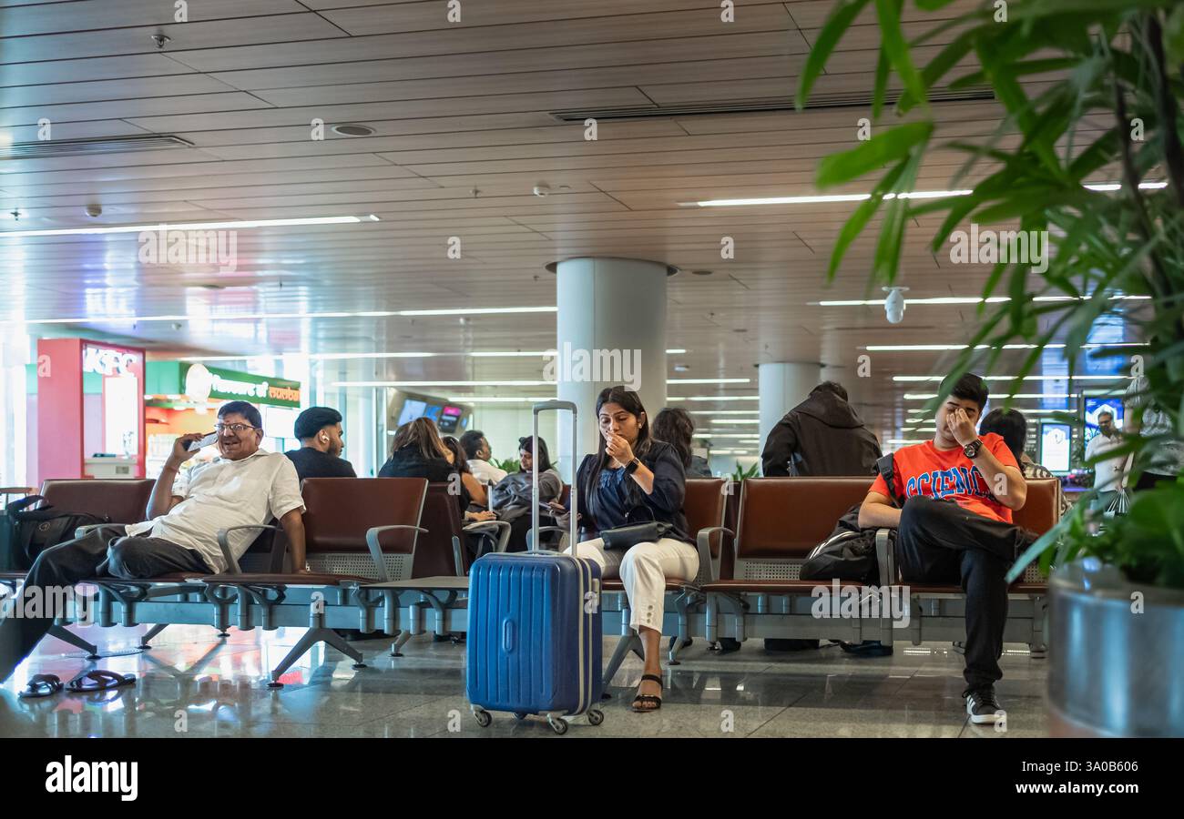 People in the terminal at the airport. Passengers waiting for boarding ...