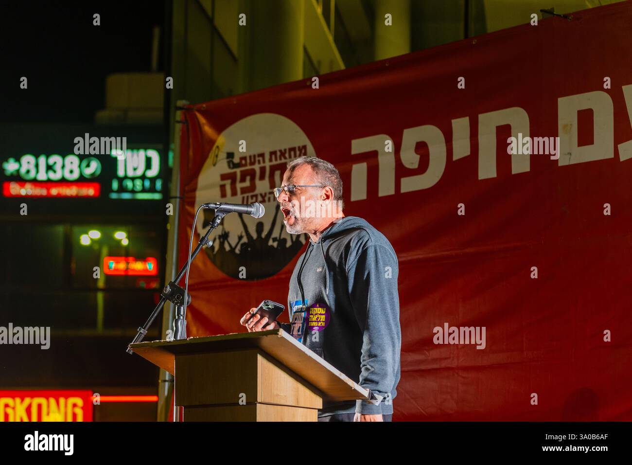 Haifa, Israel - March 01, 2025: Dan Adin speaks to the crowd, part of a ...