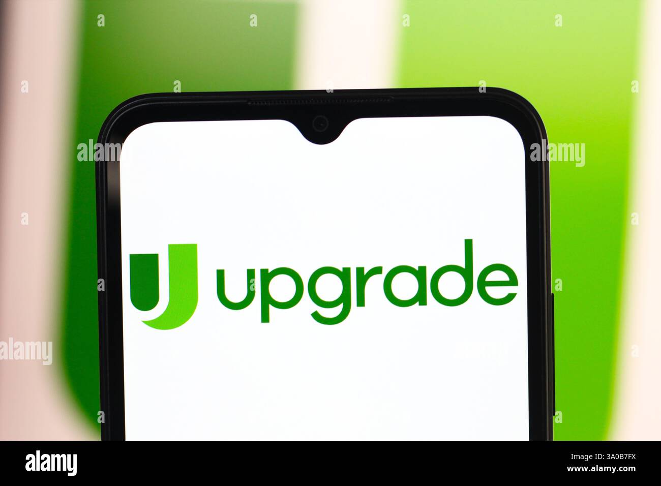 In this photo illustration, the Upgrade logo is seen displayed on a ...
