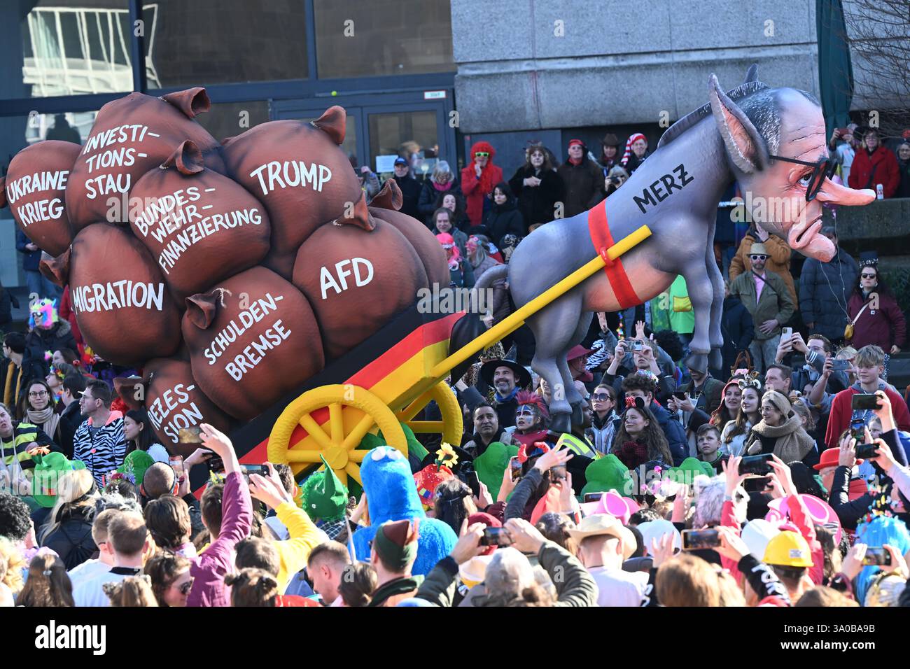 Duesseldorf, Germany. 03rd Mar, 2025. A float with Merz as a donkey ...