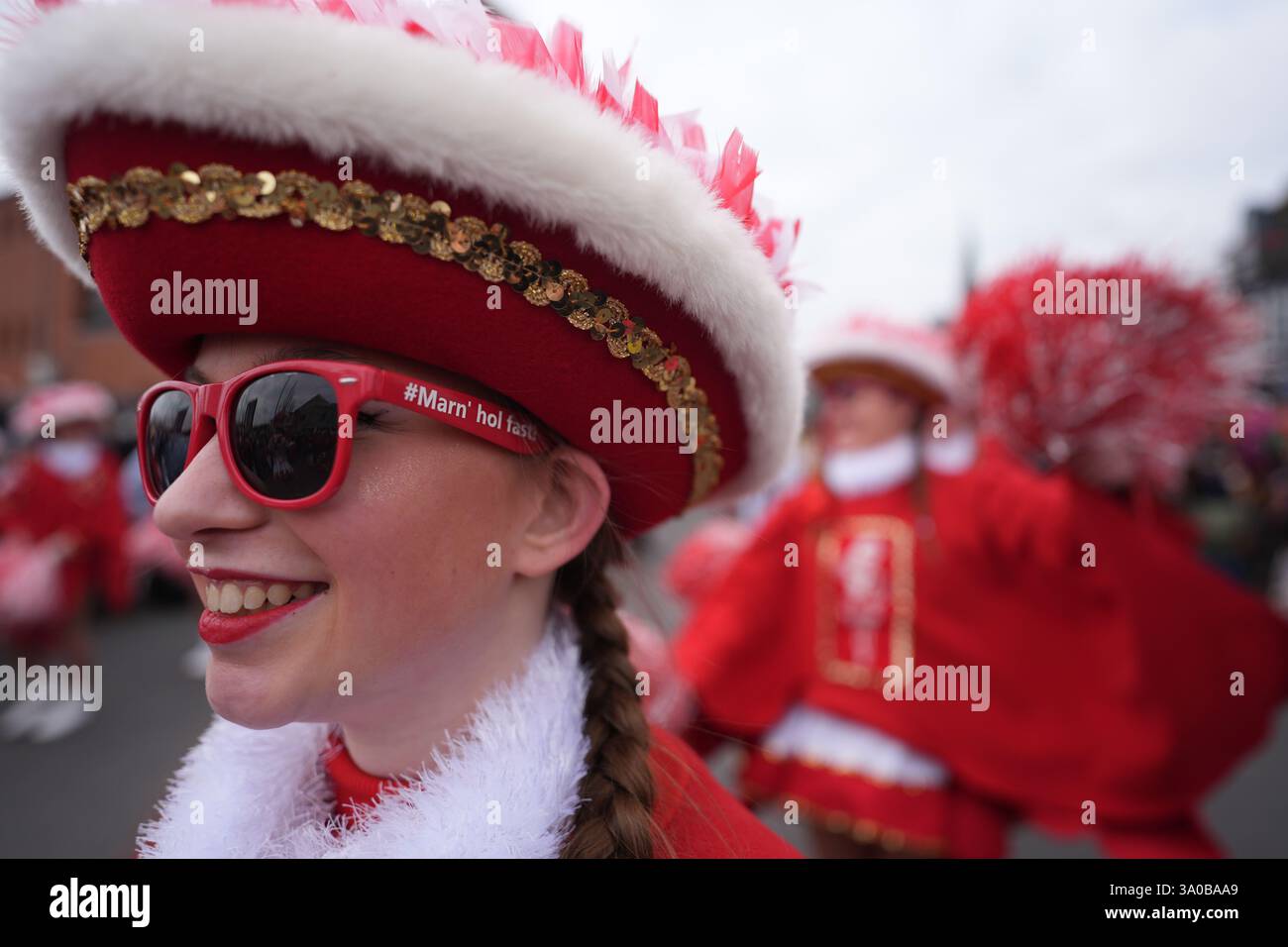 Marne, Germany. 03rd Mar, 2025. Funkenmariechen dance on the street ...