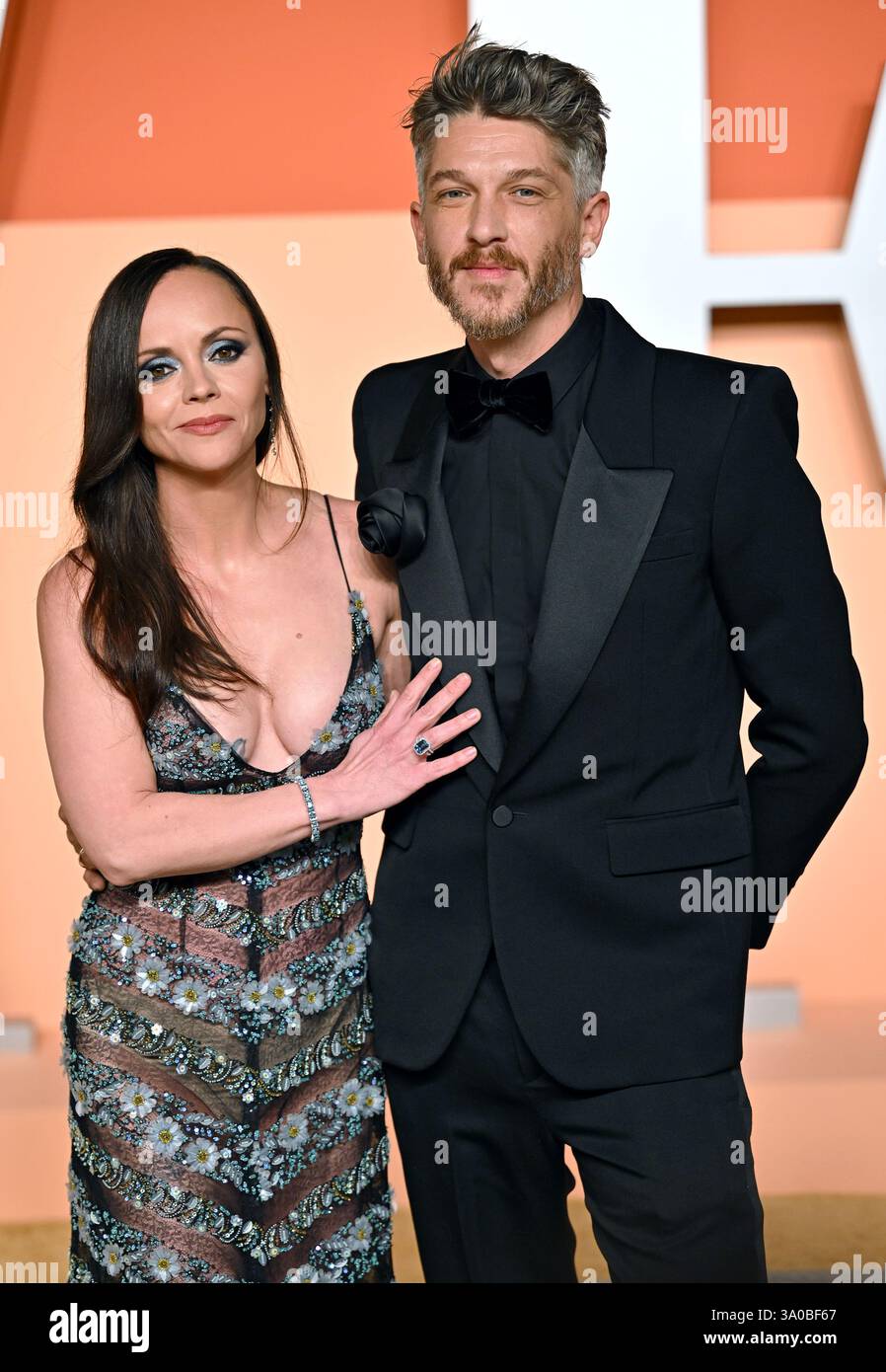 Christina Ricci (L) and Mark Hampton arrive for the Vanity Fair Oscar ...