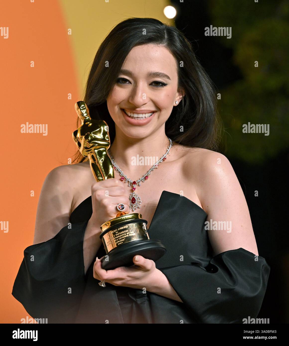 Mikey Madison holds her Oscar for Best Actress as she arrives for the Vanity Fair Oscar Party at ...
