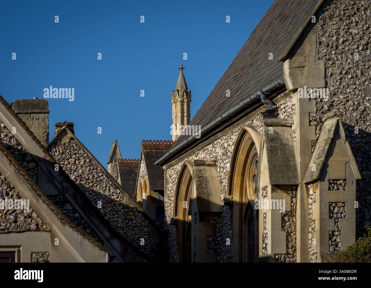 Details of church architecture showing wondows, flint wall roofs, and a ...