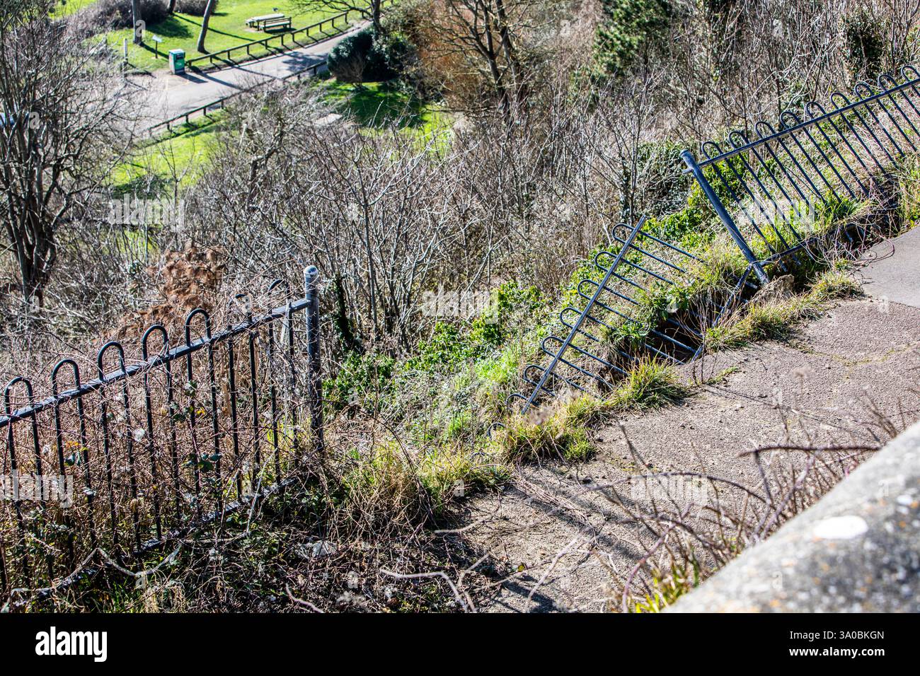 A landslide and broken railing fence on the Leas, Folkestone Stock ...