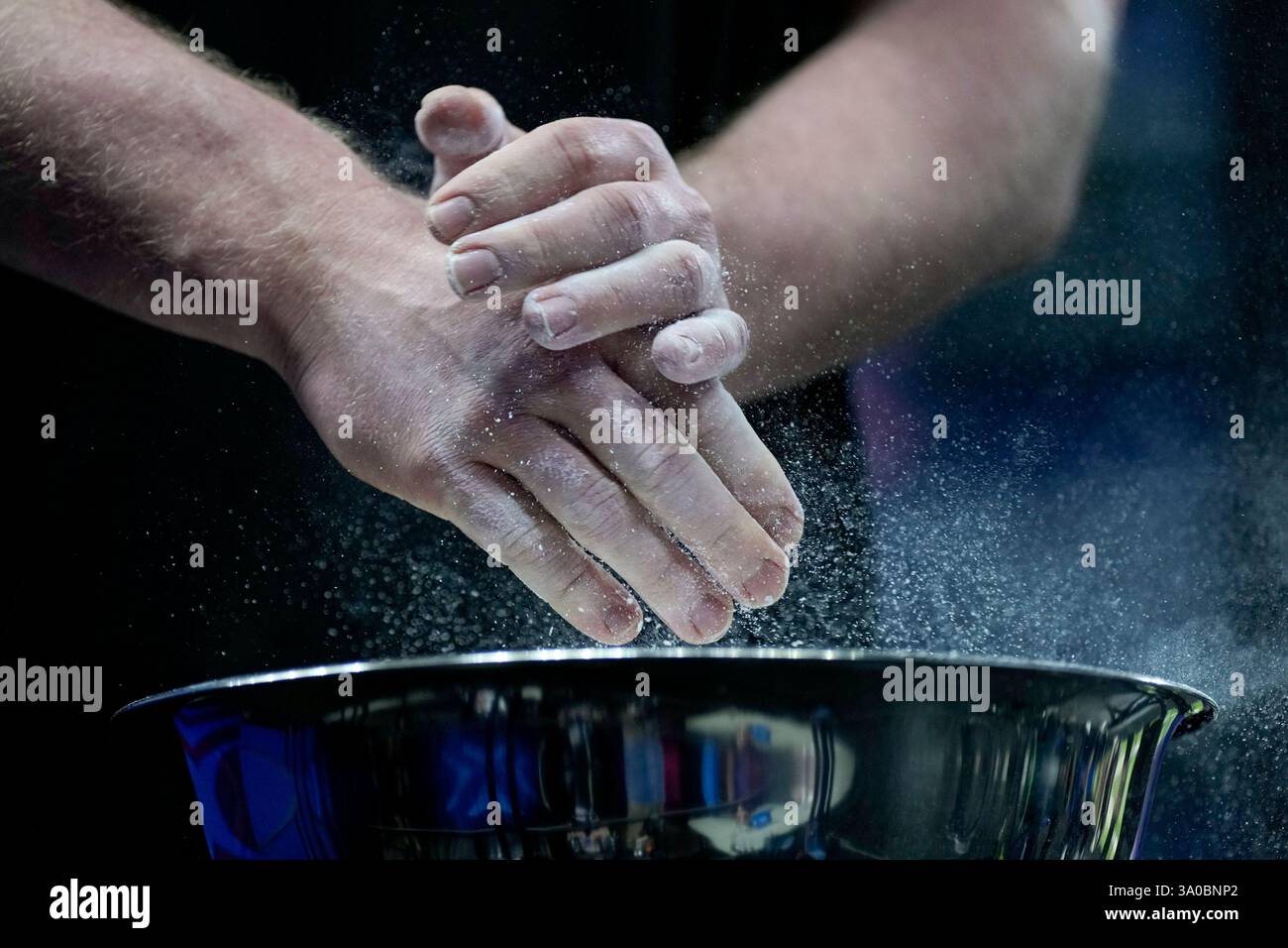 Connecticut offensive lineman Chase Lundt chalks his hands at the NFL ...