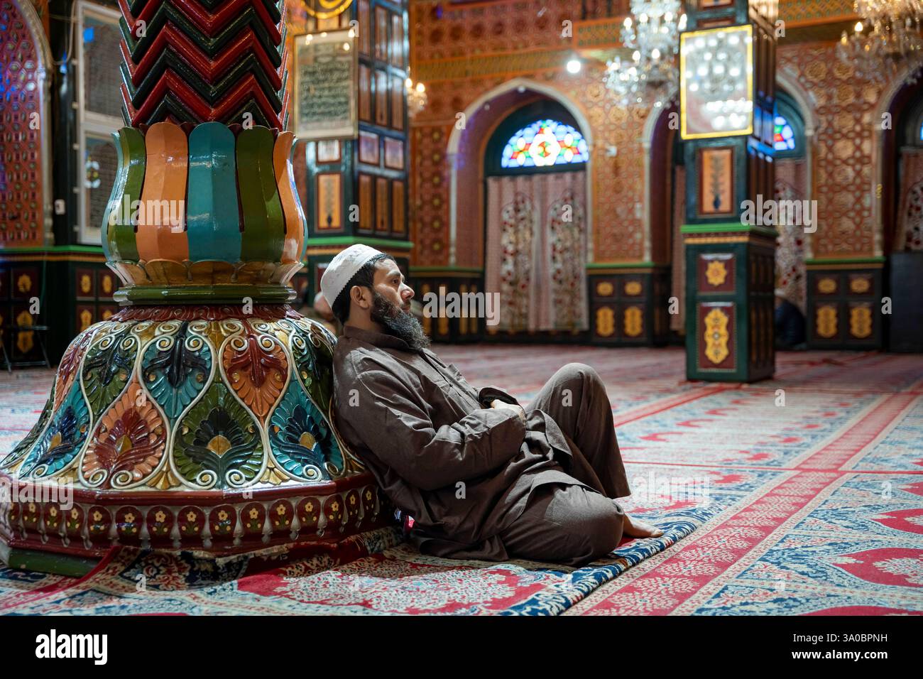 A Kashmiri Muslim man sits inside a shrine after prayers on the second ...