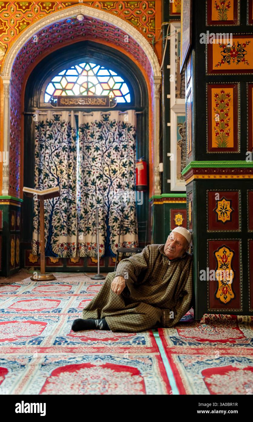 A Kashmiri Muslim man sits inside a shrine after prayers on the second ...