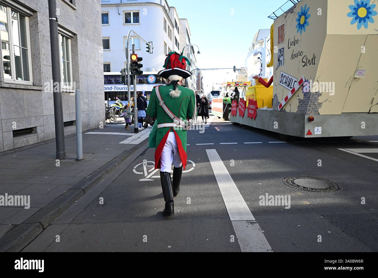 Cologne, Germany. 03rd Mar, 2025. A carnival fan goes home after the ...