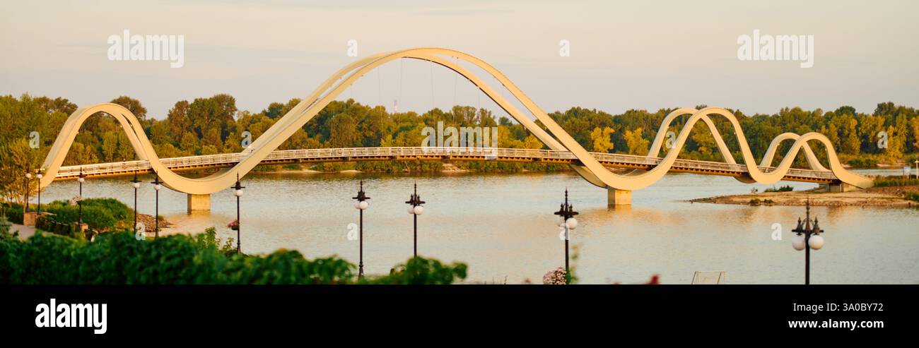 Wavy cool bridge harmonizes with the serene beauty of nature near the ...