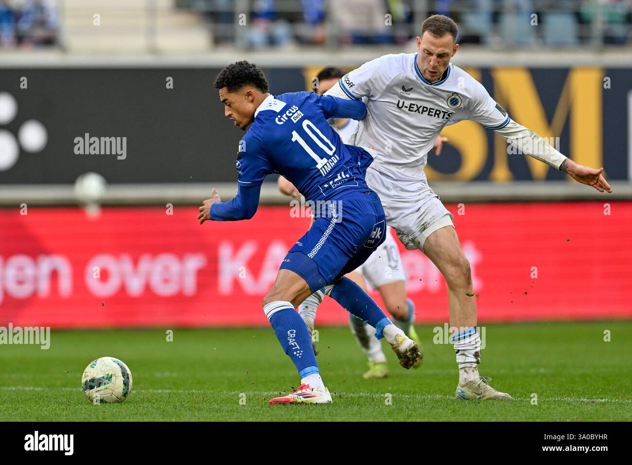 Gent, Belgium. 01st Mar, 2025. Aime Omgba (10) of AA Gent and Gustaf ...