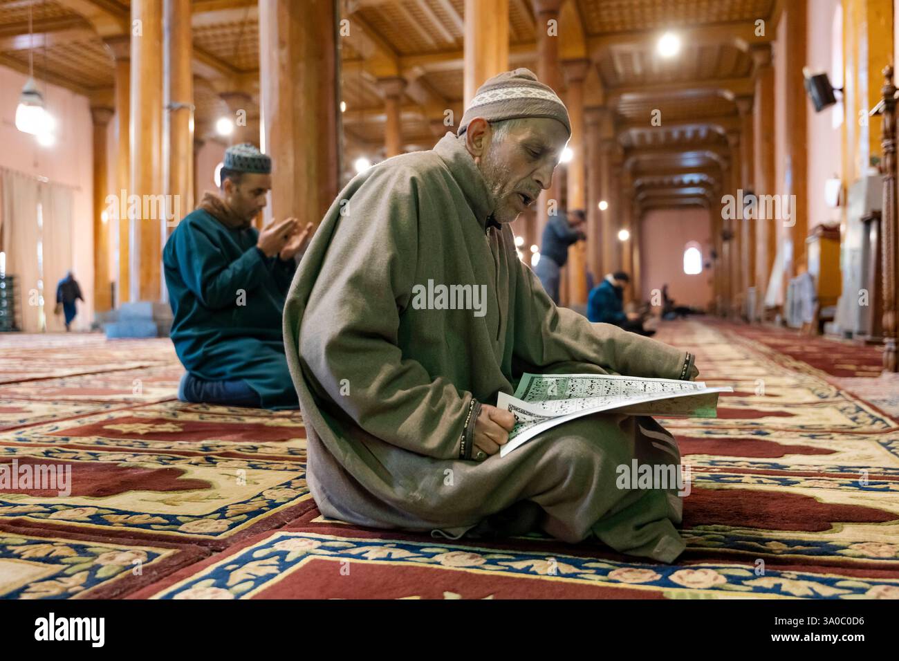Srinagar, India. 03rd Mar, 2025. A Kashmiri Muslim man recites from the ...
