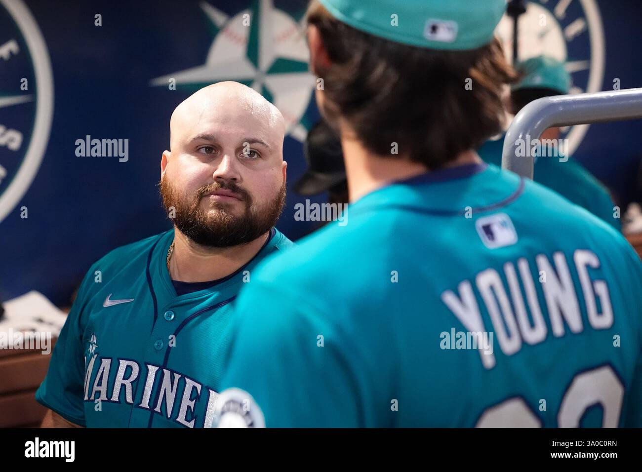 Seattle Mariners first baseman Rowdy Tellez looks over at teammate Cole ...