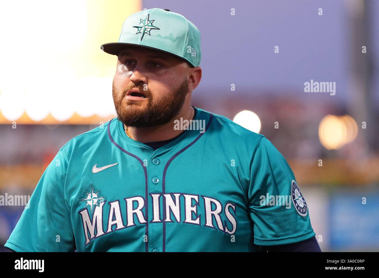 Seattle Mariners' Rowdy Tellez walks to the dugout before a spring ...