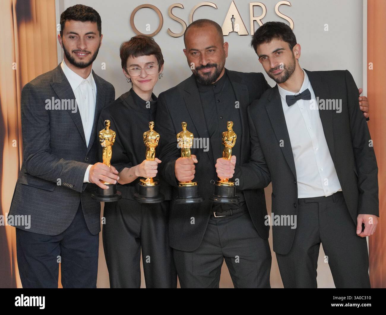Los Angeles, USA. 02nd Mar, 2025. (L-R) Basel Adra, Rachel Szor, Hamdan ...