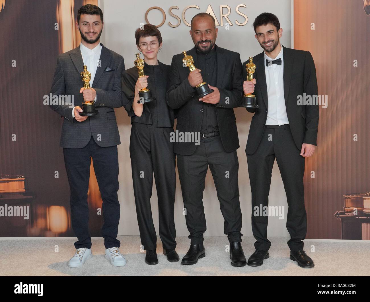 Los Angeles, USA. 02nd Mar, 2025. (L-R) Basel Adra, Rachel Szor, Hamdan ...
