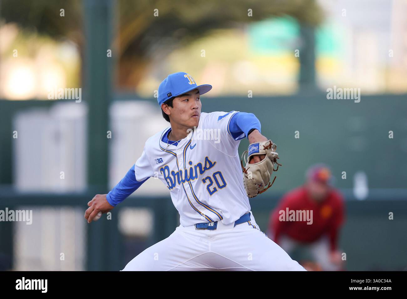 March 2, 2025: UCLA pitcher Justin Lee (20) delivers a pitch during an ...