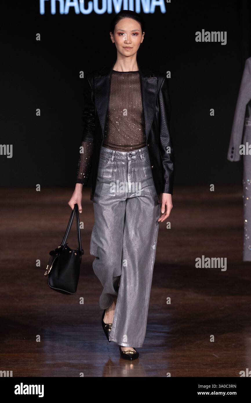 Milan, Italy. 24 Feb, 2025. A model walks the runway during the ...