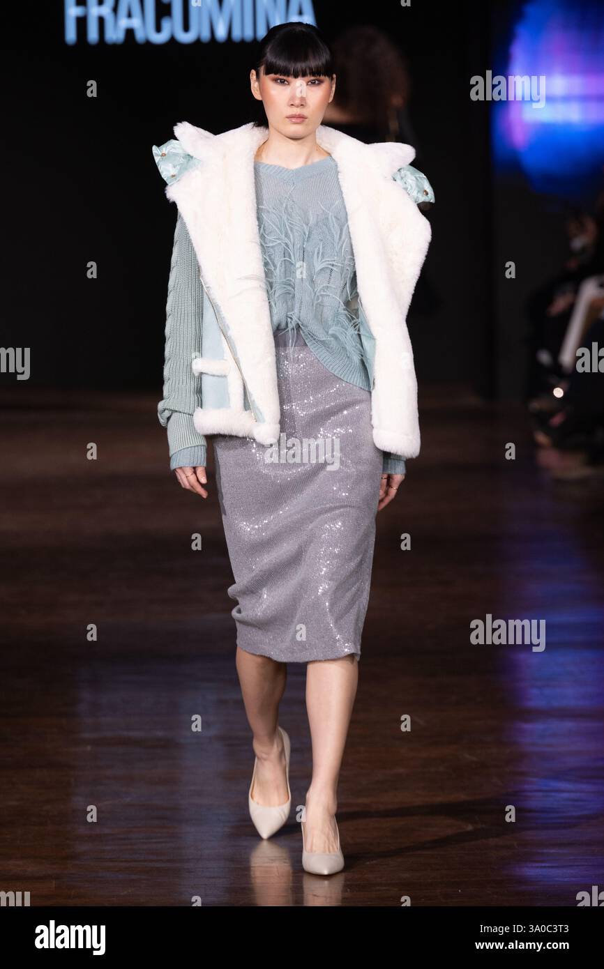 Milan, Italy. 24 Feb, 2025. A model walks the runway during the ...