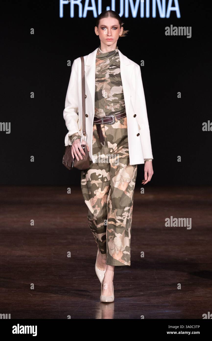 Milan, Italy. 24 Feb, 2025. A model walks the runway during the ...