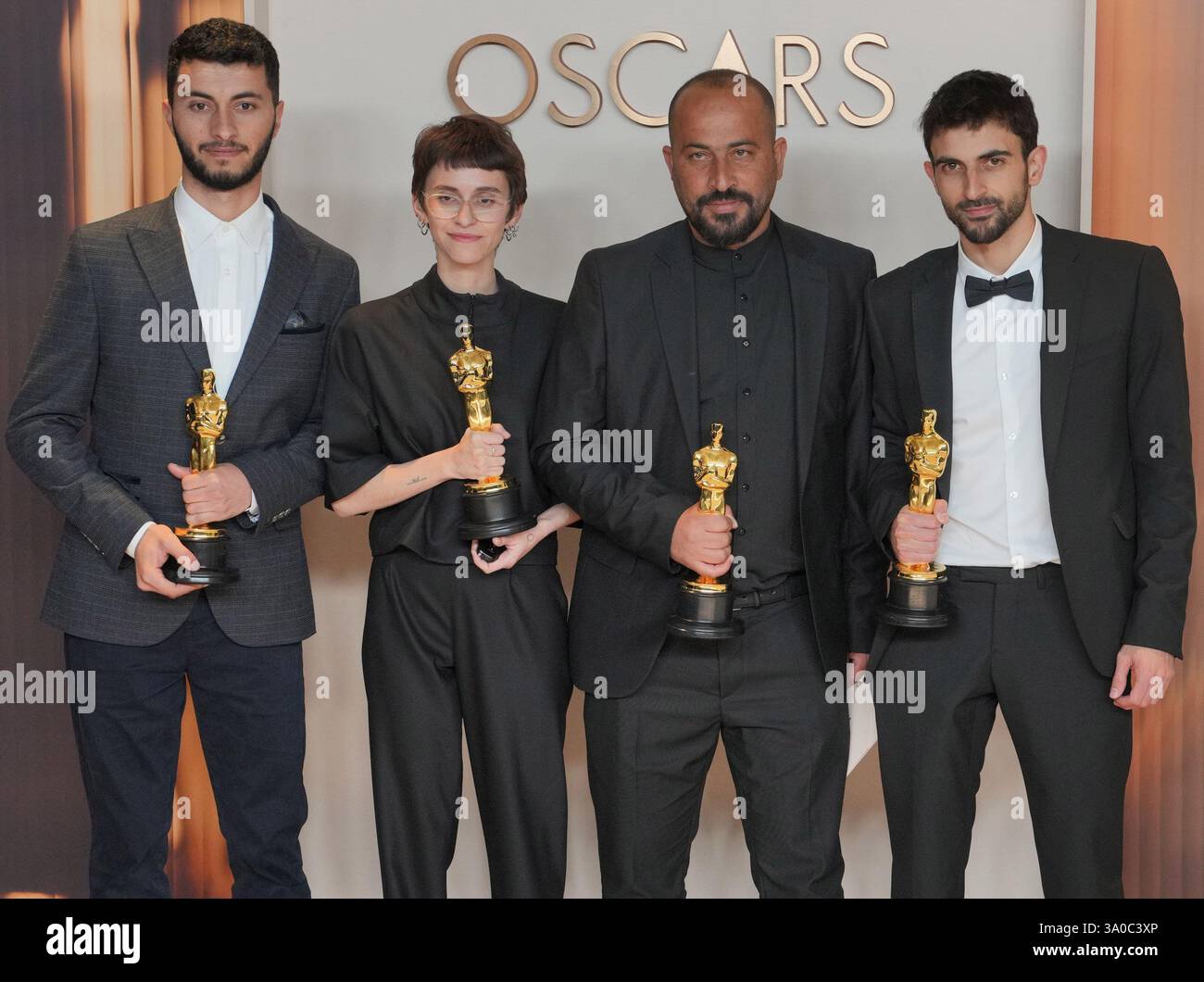 Los Angeles, USA. 02nd Mar, 2025. (L-R) Basel Adra, Rachel Szor, Hamdan ...