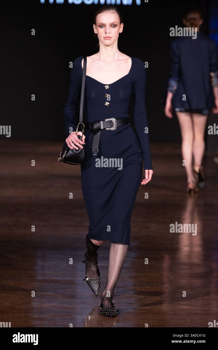 Milan, Italy. 24 Feb, 2025. A model walks the runway during the ...