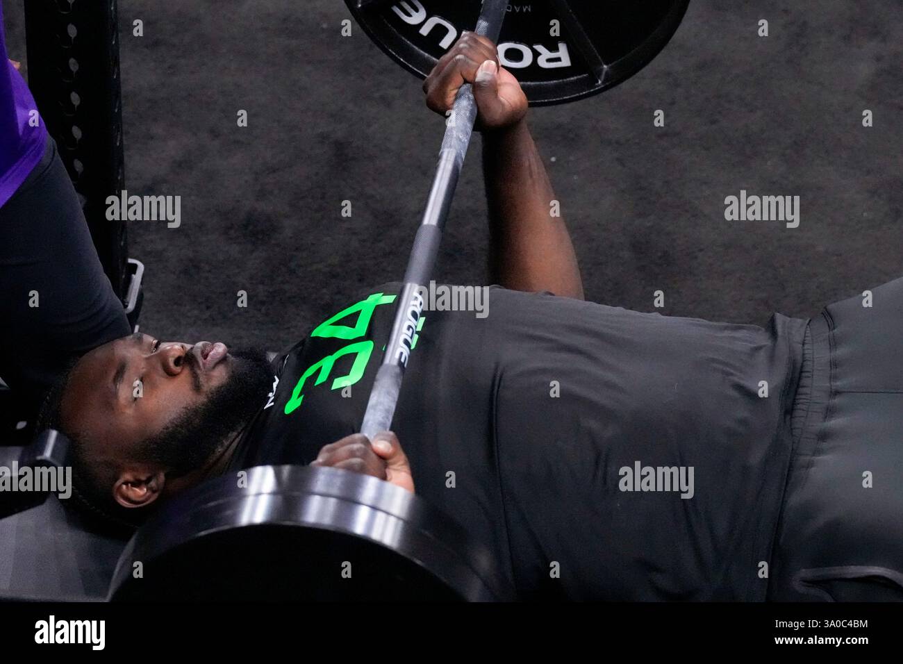 Miami offensive lineman Jalen Rivers lifts weights at the NFL football ...