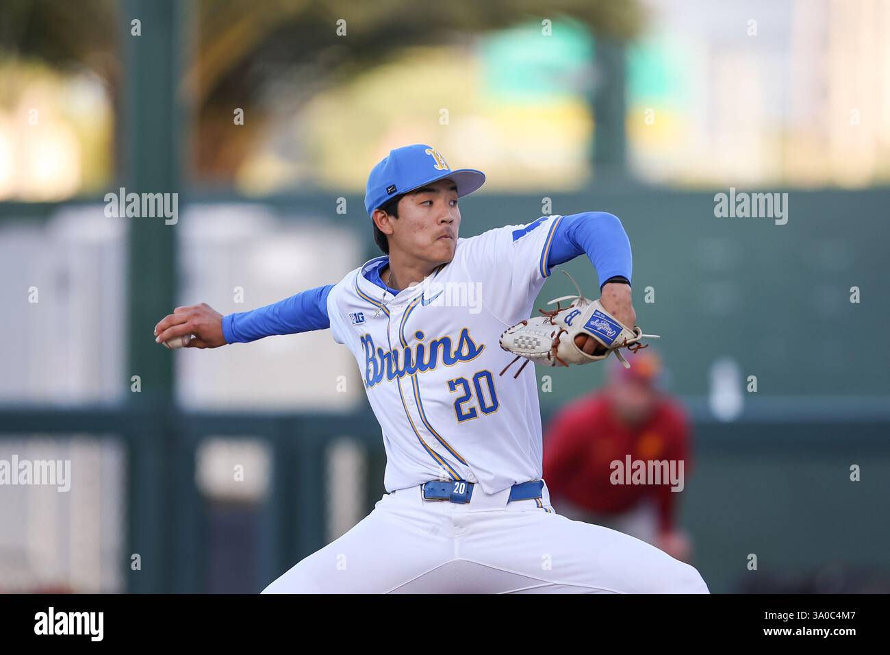 March 2, 2025: UCLA pitcher Justin Lee (20) delivers a pitch during an ...