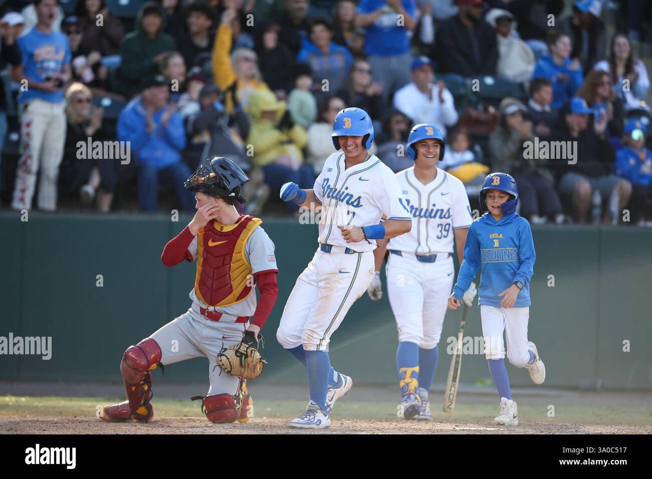 March 2, 2025: UCLAâ€™s Roman Martin (7) crosses home plate following a ...