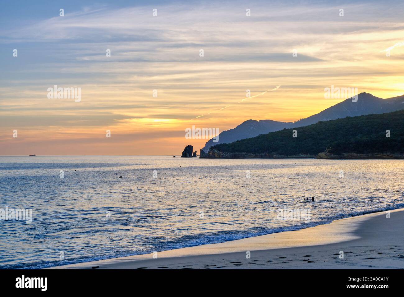 Galapos beach in the Arrabida Natural Park, at sunset. Setubal ...
