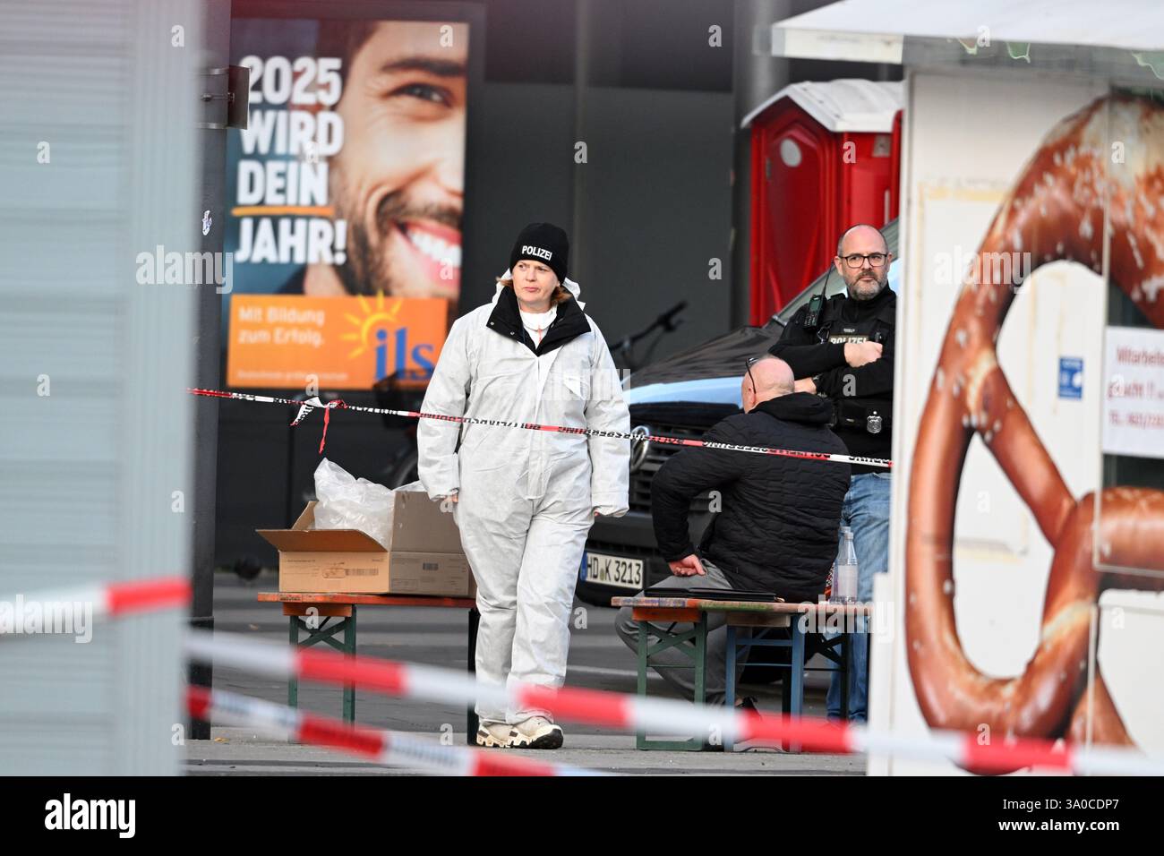 03 March 2025, Baden-Württemberg, Mannheim: Police officers investigate ...