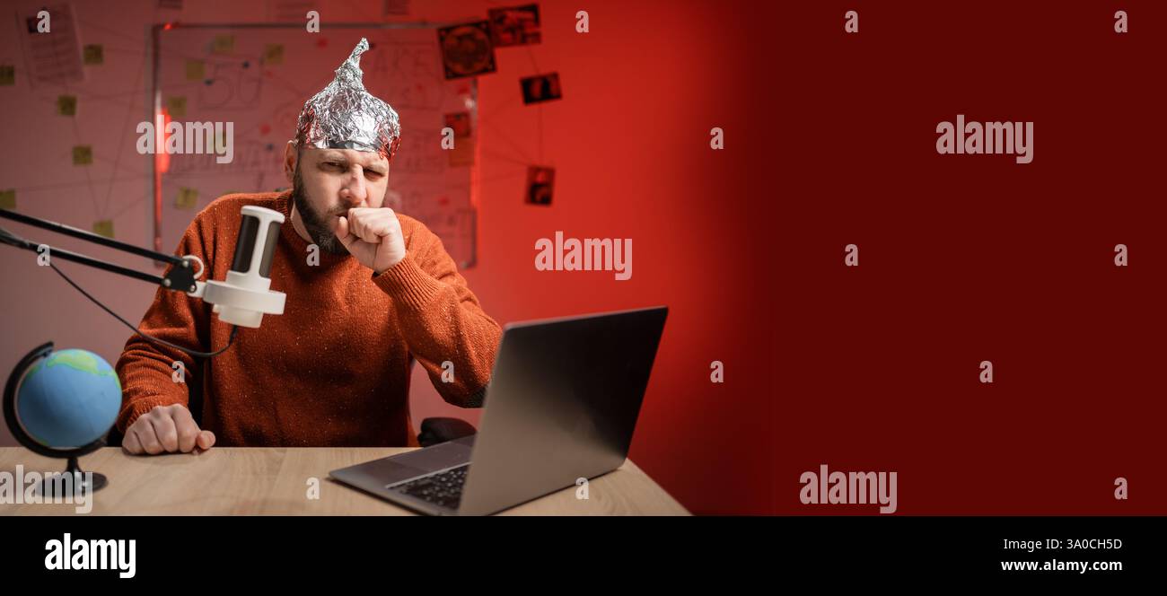 Bearded man in aluminum foil hat coughing holding hands while Live ...