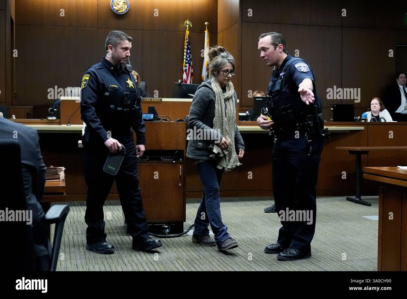 Robert E. Crimo III's mother Denise Pesina walks back to her seat after ...