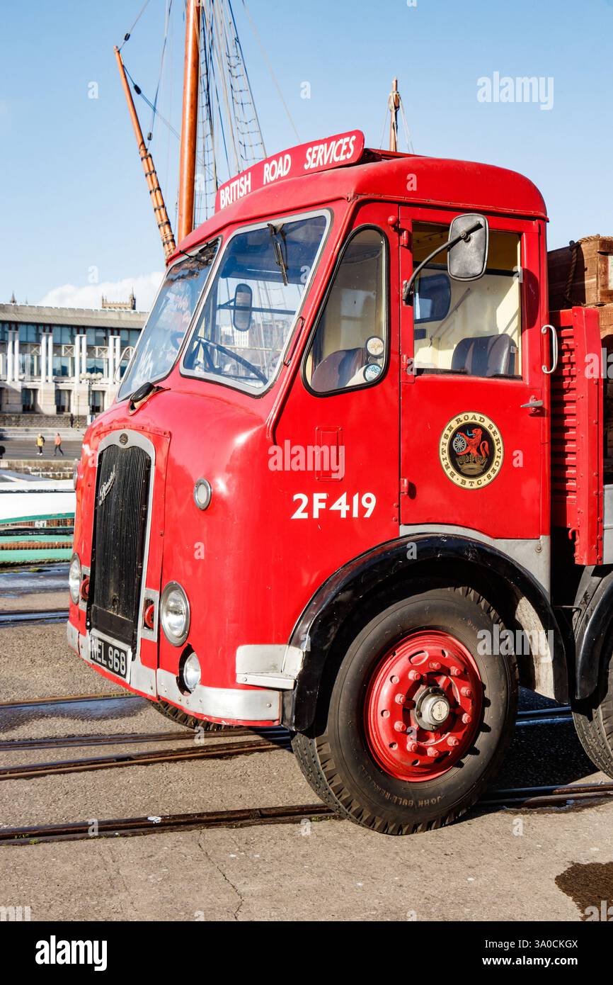A vintage red British Road Services Bristol truck loaded with barrels ...